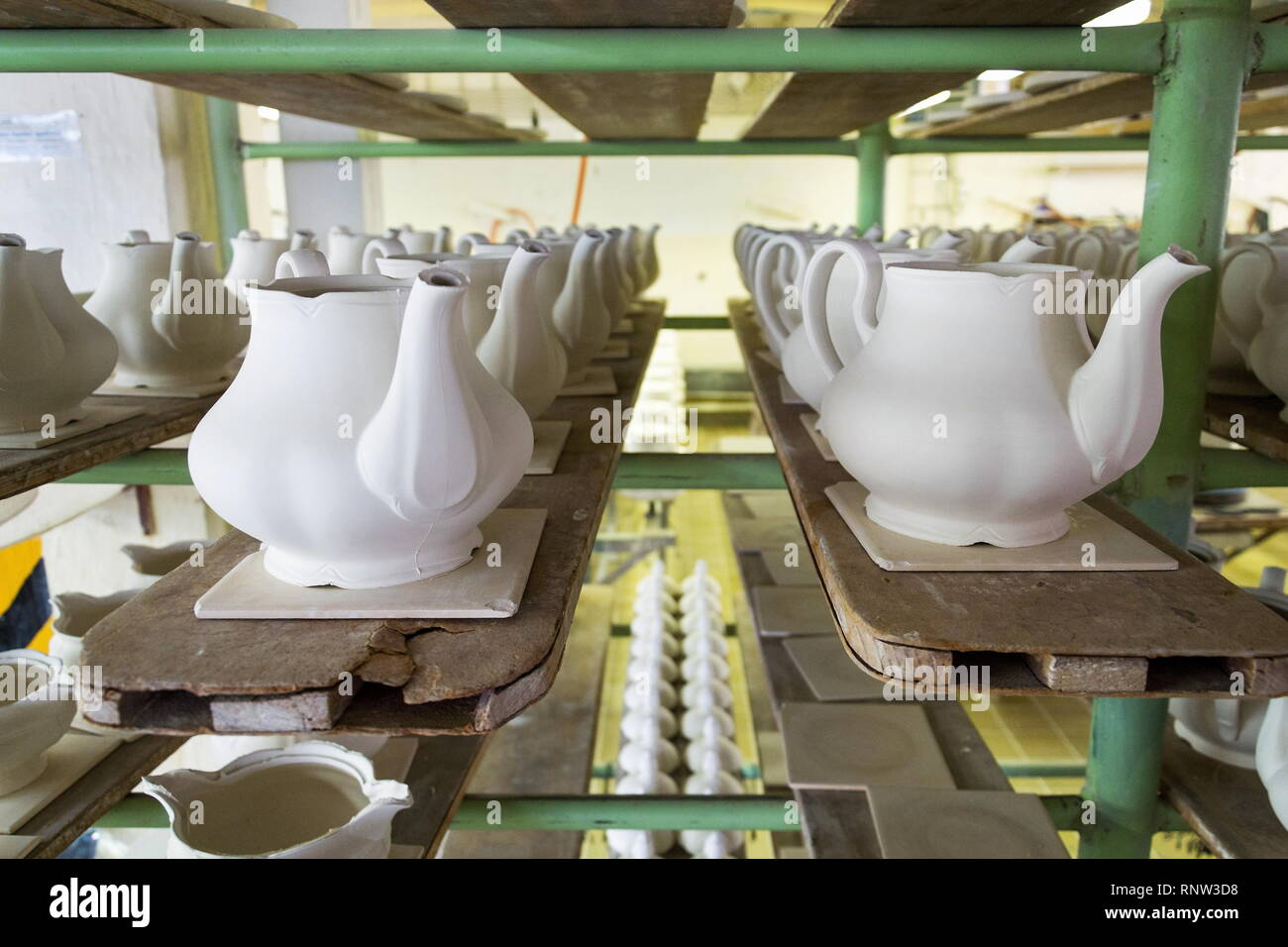 Traditional ceramics pottery on production line in factory Stock Photo ...