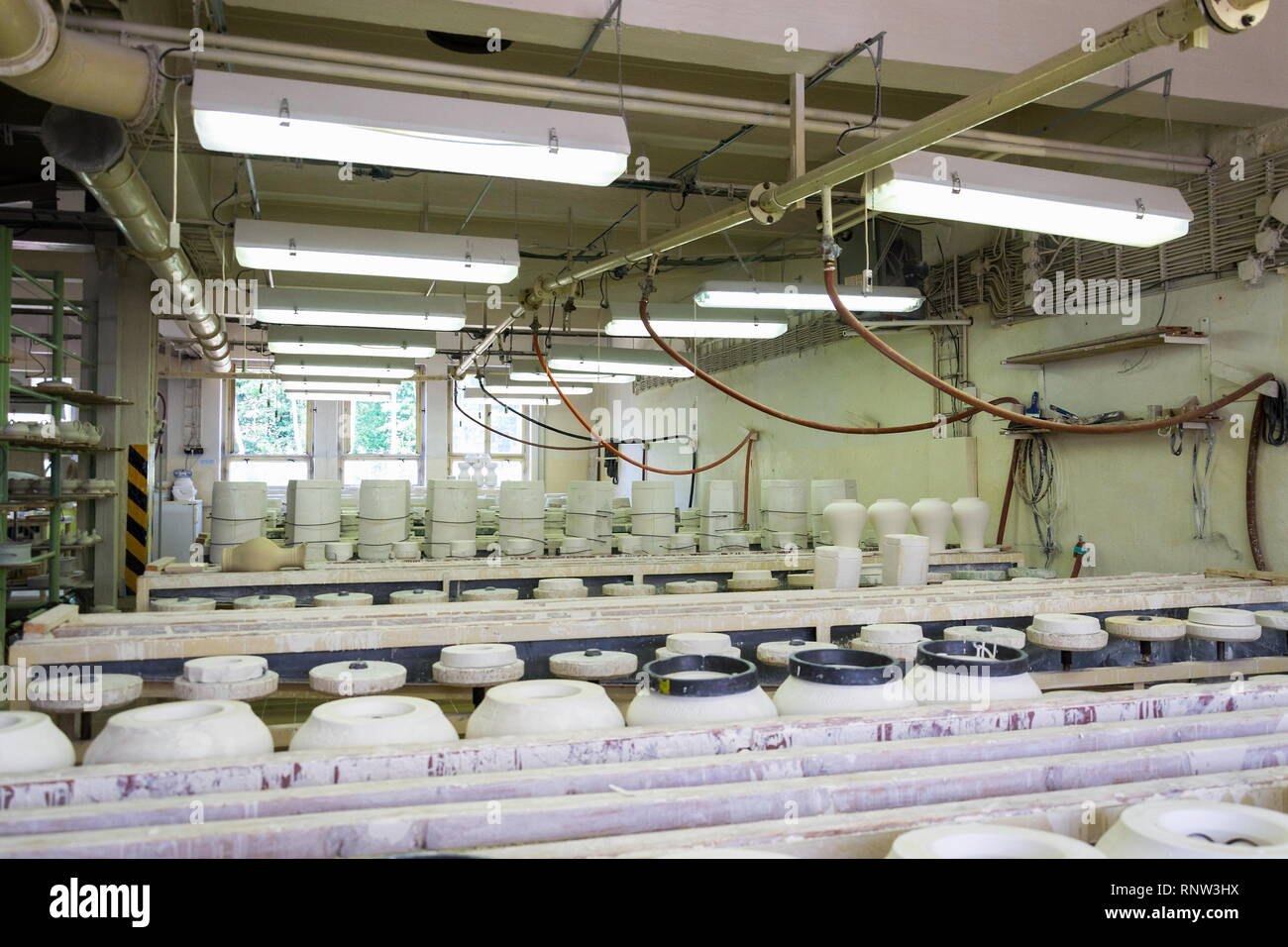 Traditional ceramics pottery on production line in factory Stock Photo ...