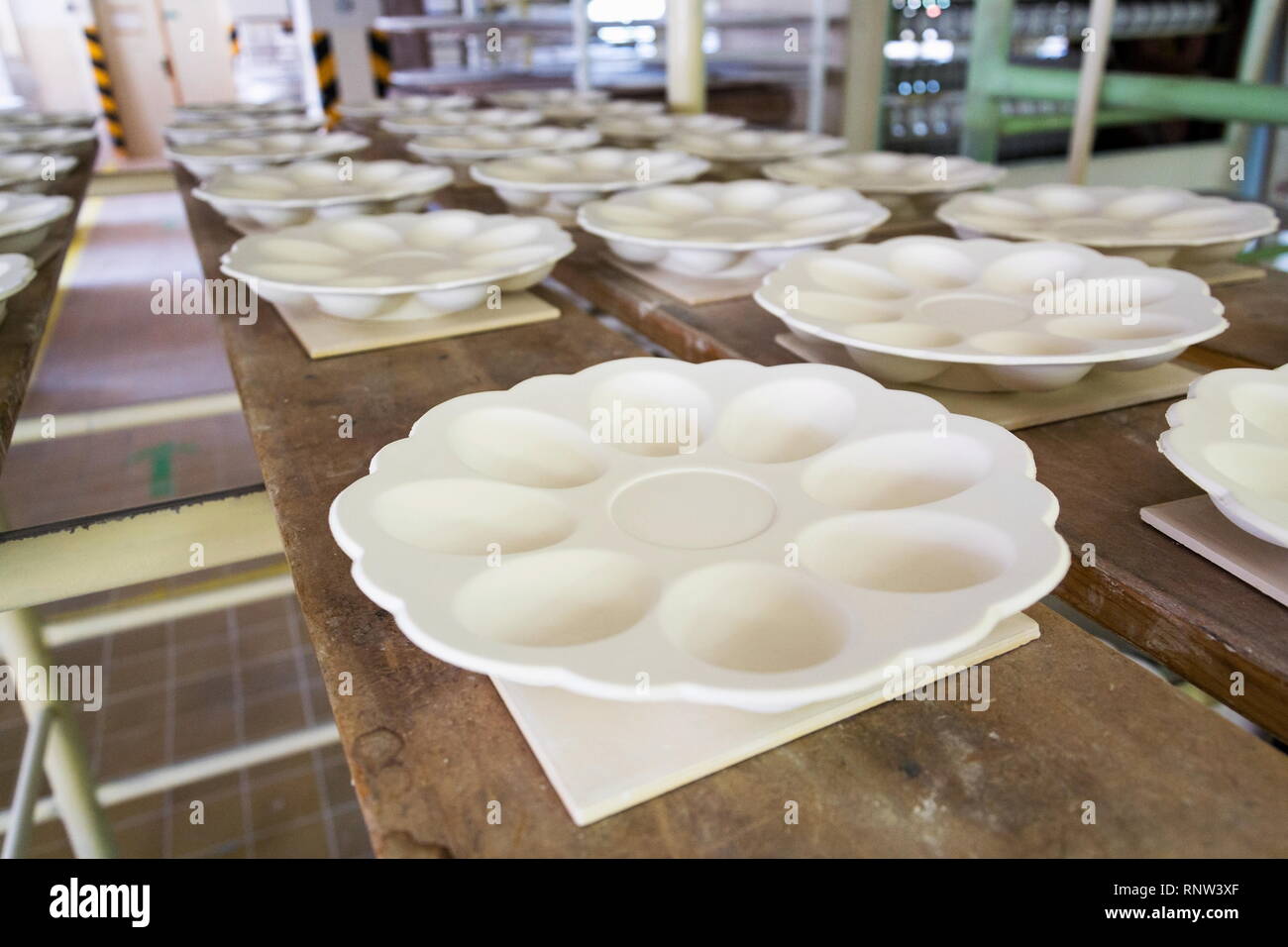 Traditional ceramics pottery on production line in factory Stock Photo ...