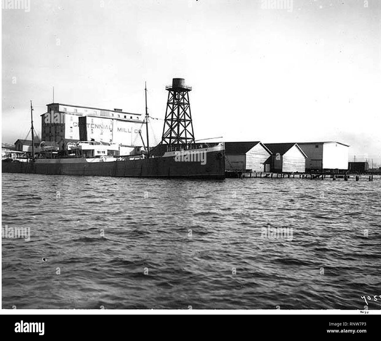 Centennial Mill Co dock foot of Yesler Way with steamer ROMFORD loading ...