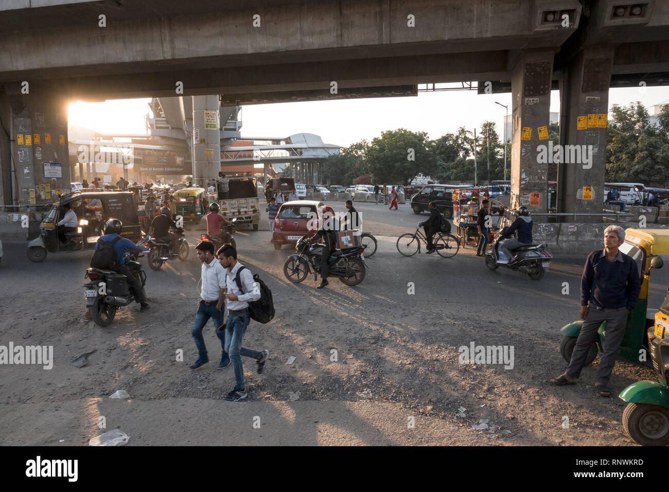 Pedestrians and traffic under the overpass at Dhaula Kuan in New Delhi ...