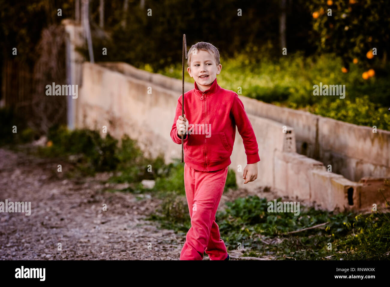 Child exploring the countryside and enjoying his freedom to play in ...