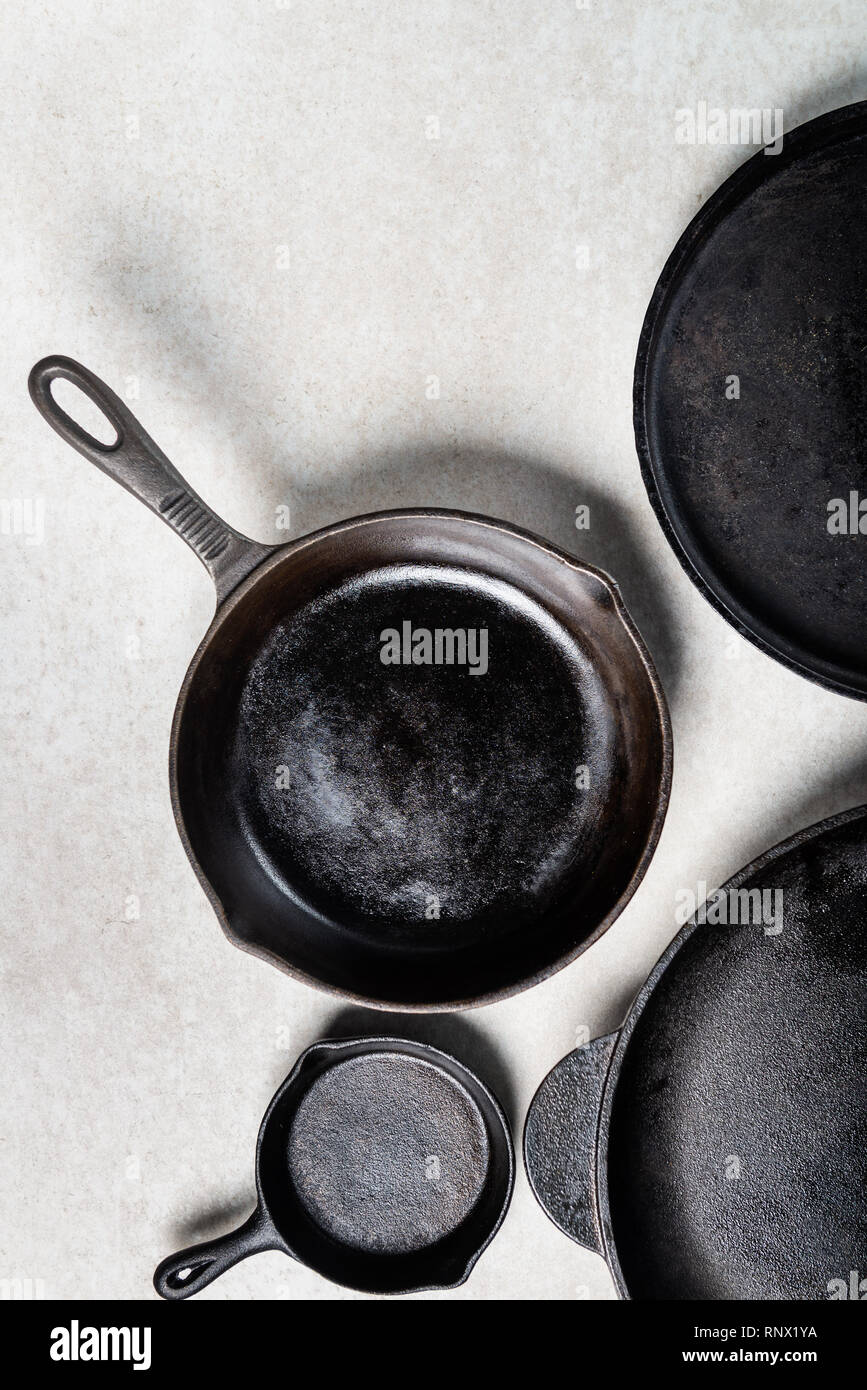 Several Cast Iron Pans or Skillets for Healthy Cooking on Grey ...