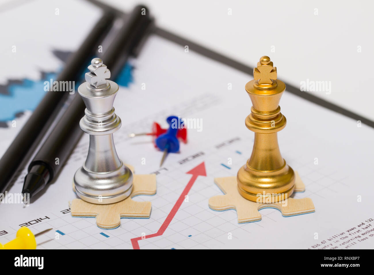 Puzzles and economic charts, teamwork, career success Stock Photo - Alamy