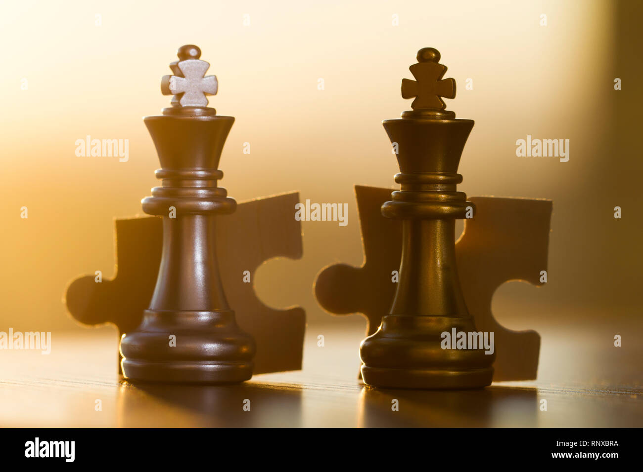 Chess pieces and puzzles, teamwork Stock Photo - Alamy