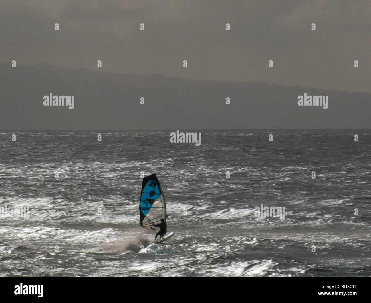 backlit windsurfer at ho'okipa with resulting in color pass effect ...