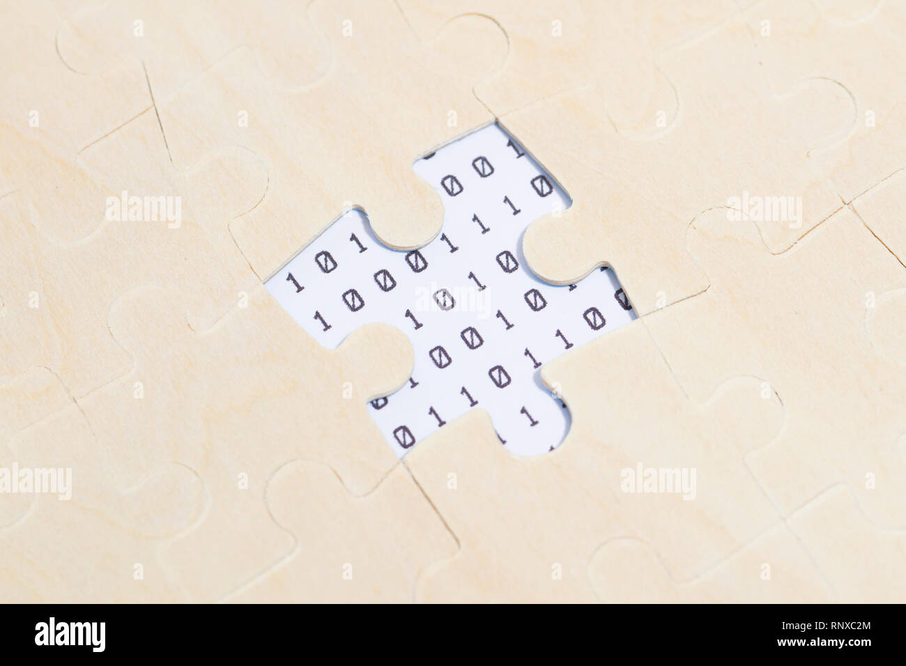 Puzzles and binary code, teamwork, career success Stock Photo - Alamy
