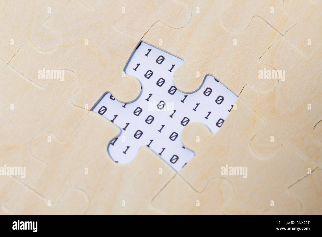 Puzzles and binary code, teamwork, career success Stock Photo - Alamy