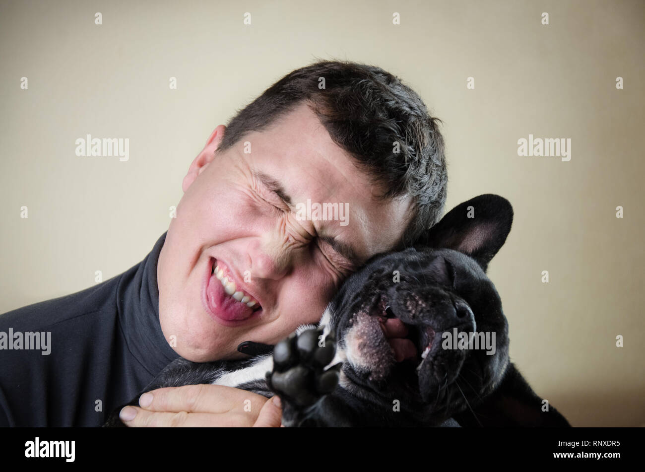 Delighted handsome guy smiling hi-res stock photography and images - Alamy