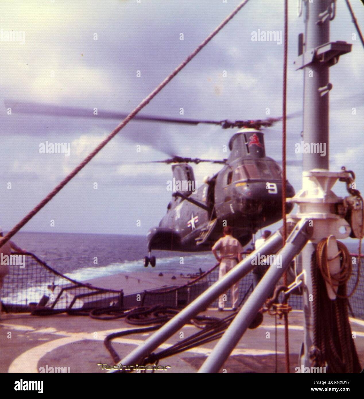 CH-46 Sea Knight over USS Hanson (DD-832) in the Gulf of Tonkin, in ...