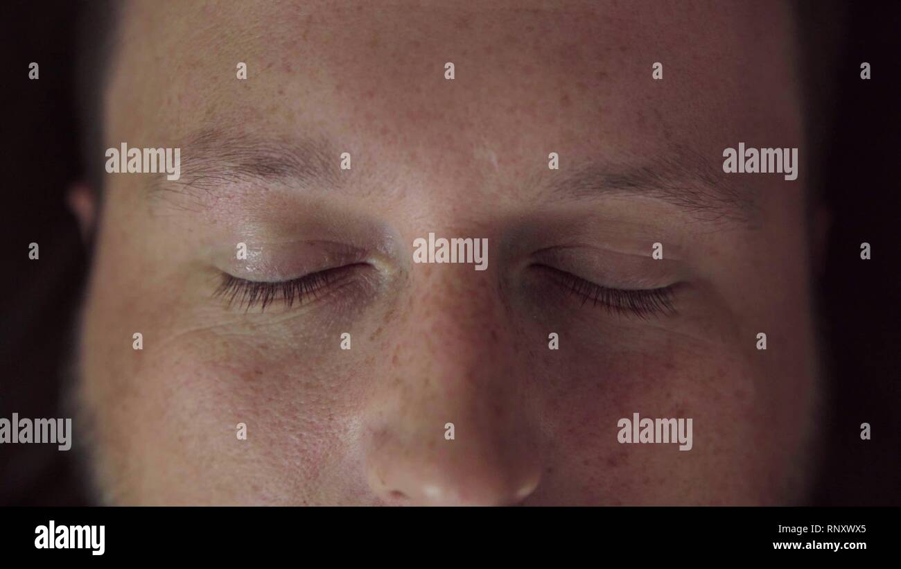 Beautiful blinking male eye close hi-res stock photography and images ...