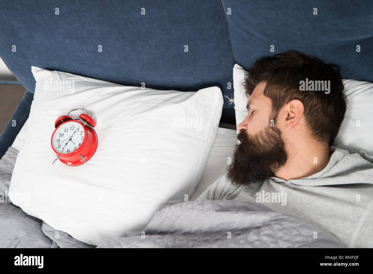 Man Bearded Hipster Sleepy Face In Bed With Alarm Clock Problem With