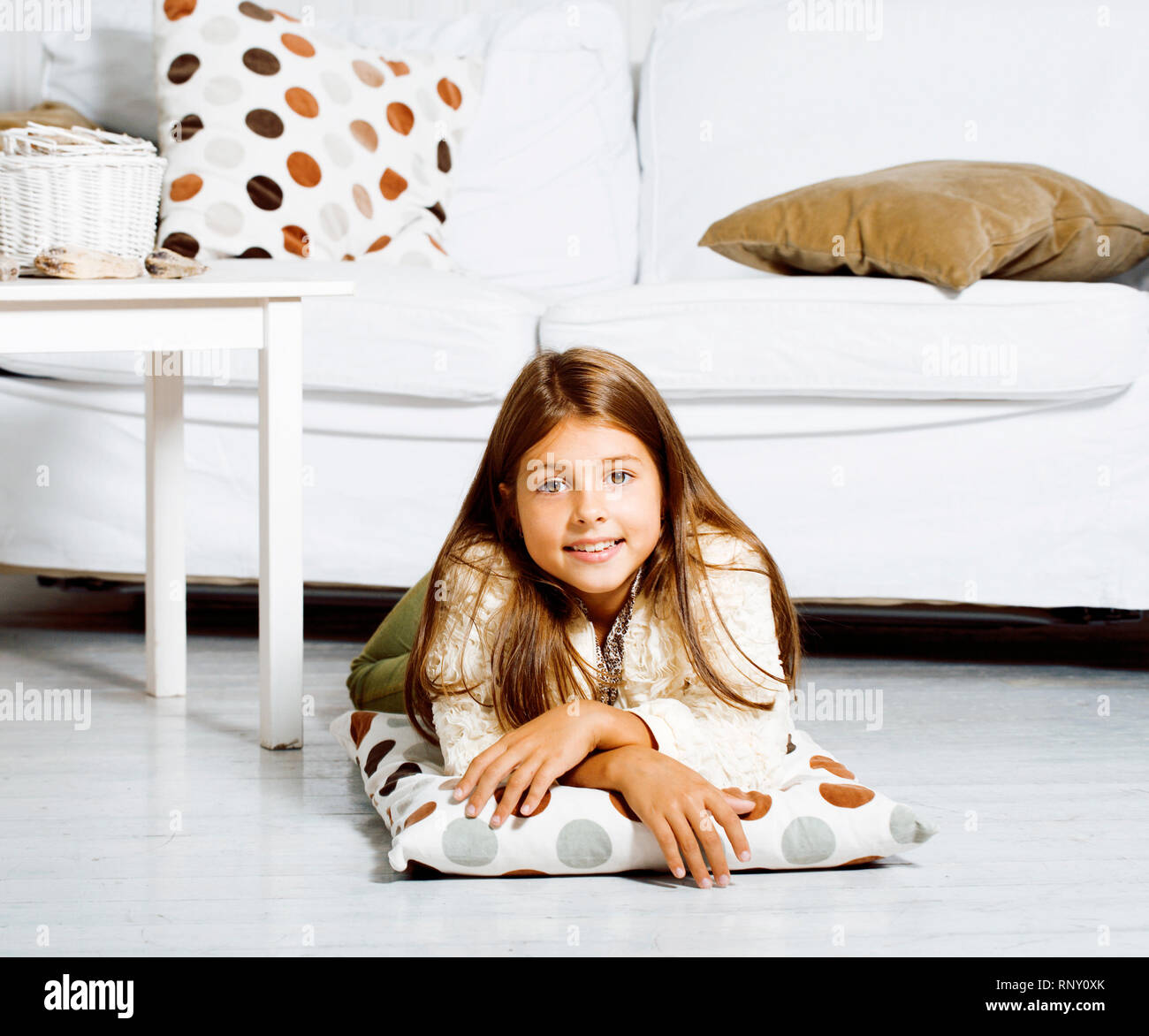 little cute brunette girl at home interior happy smiling close up ...