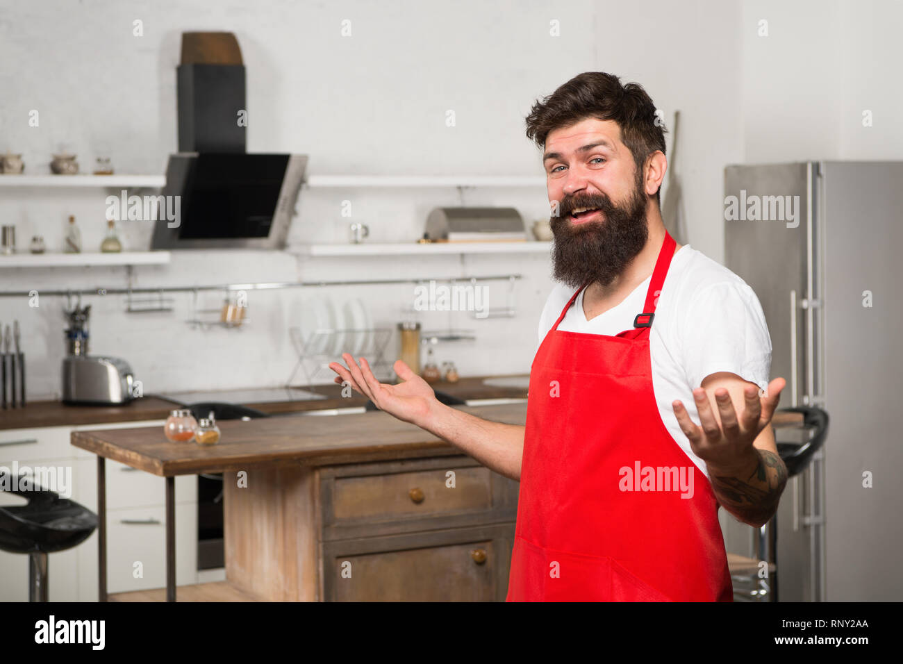 Welcome in the world of tastes. Hipster in kitchen. Restaurant or cafe ...