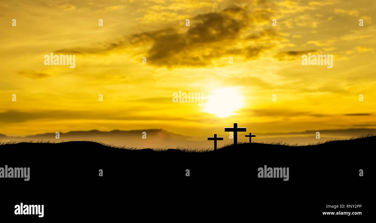 Sun rising on three Christian crosses Stock Photo - Alamy