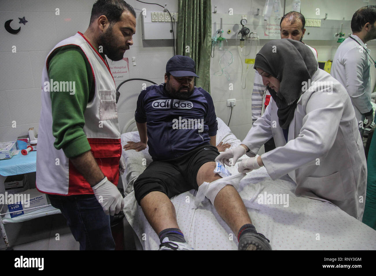 Gaza, Palestine. 19th Feb, 2019. Paramedics treat a Palestinian ...