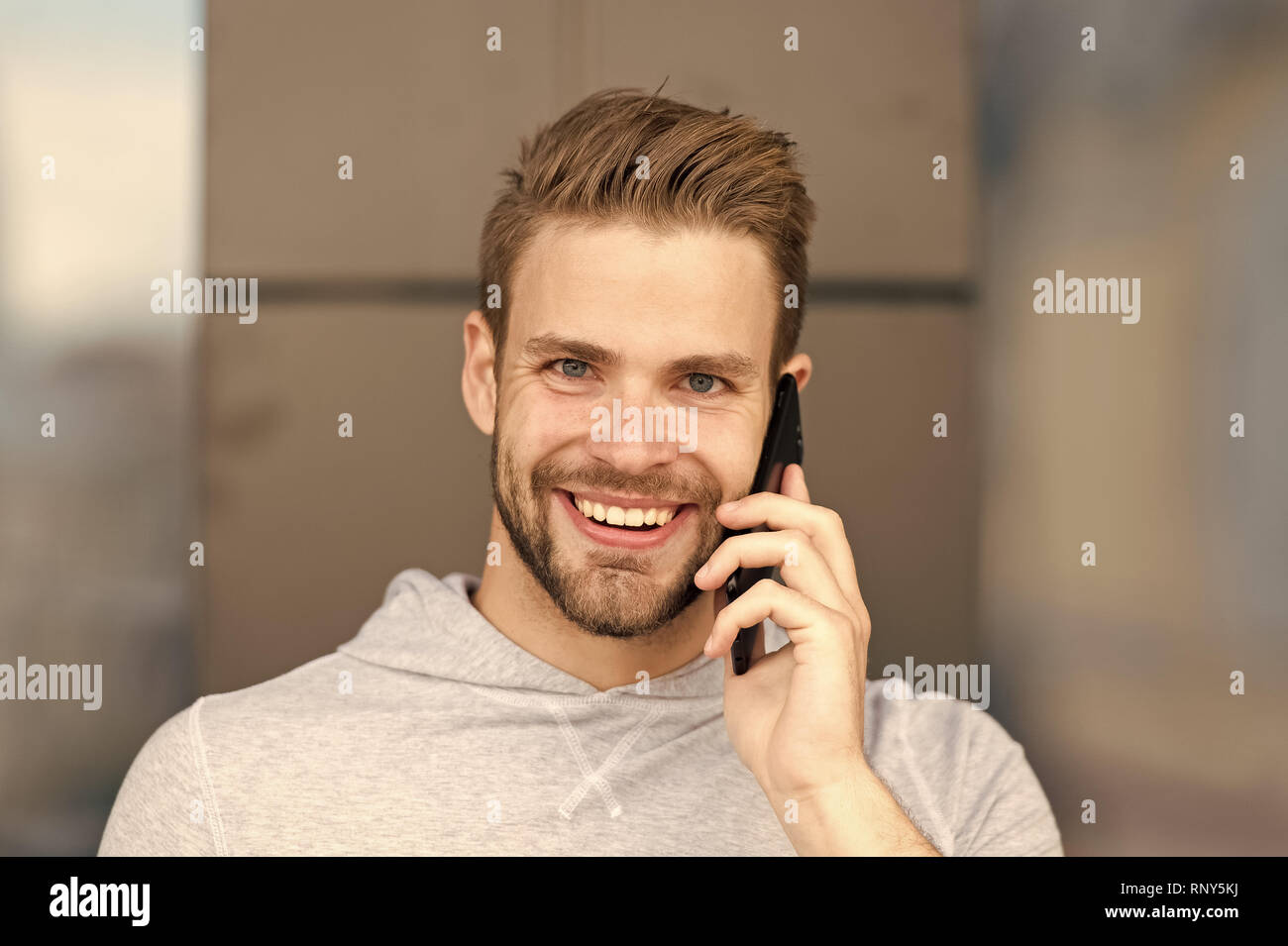 I was waiting for your call. Man beard with smartphone, urban ...