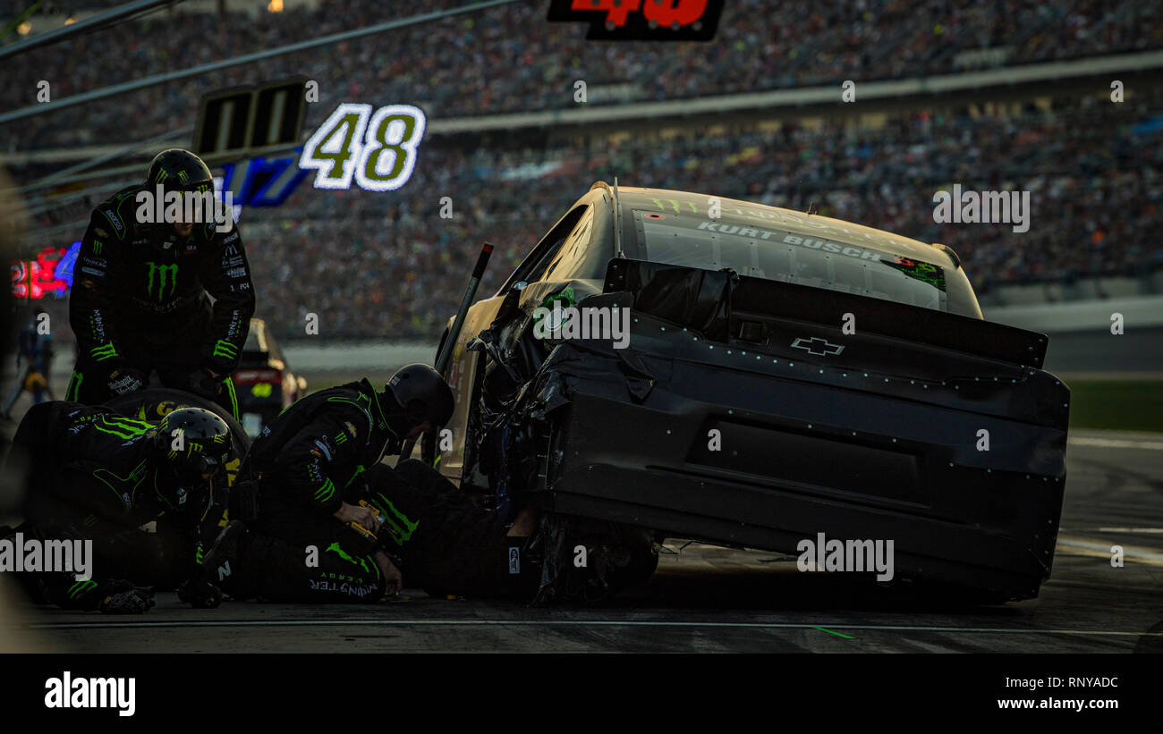 Kurt Busch and the Monster Energy pit crew perform maintenance on the ...