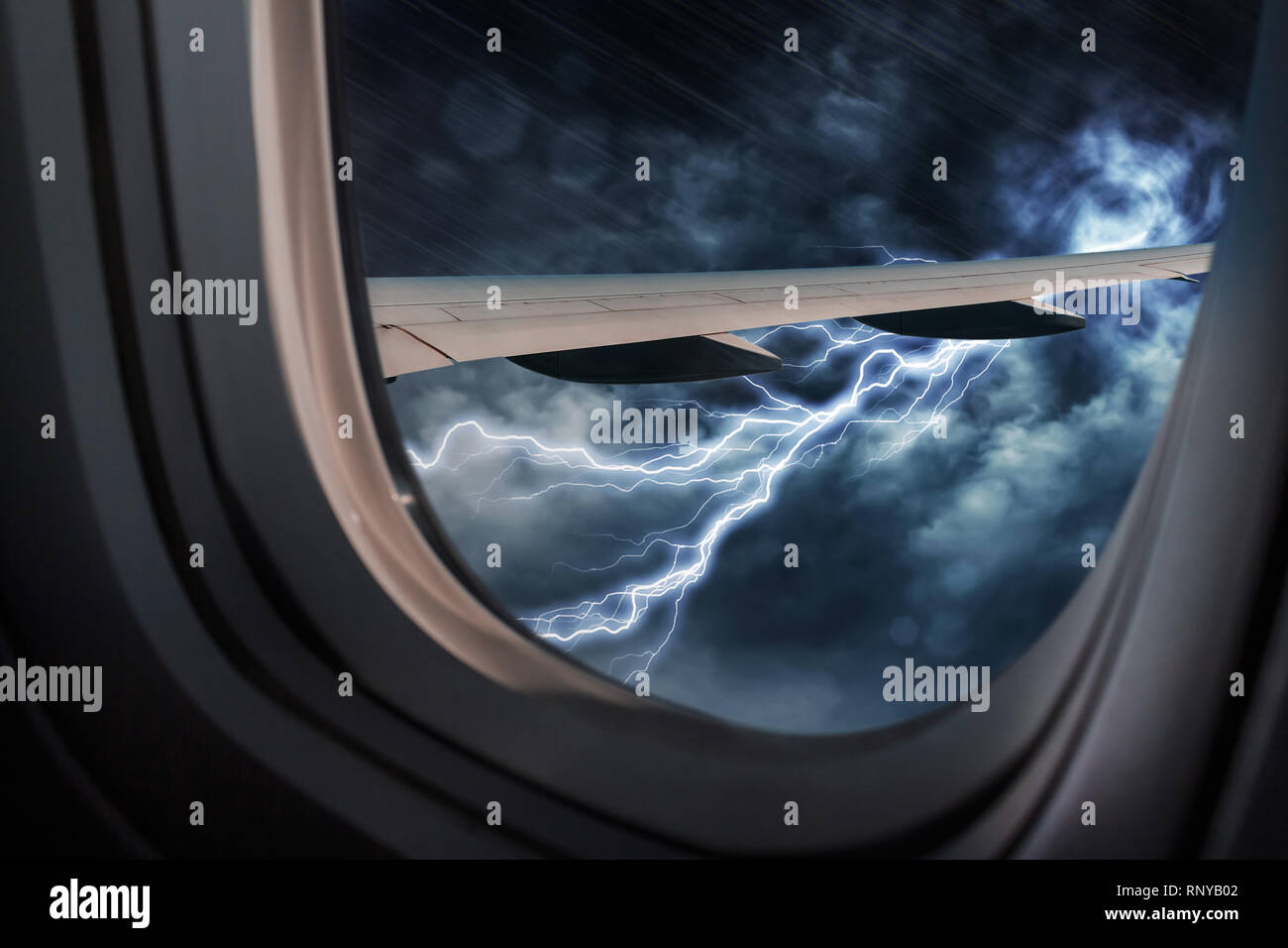 View from airplane window with a thunderstorm Stock Photo - Alamy