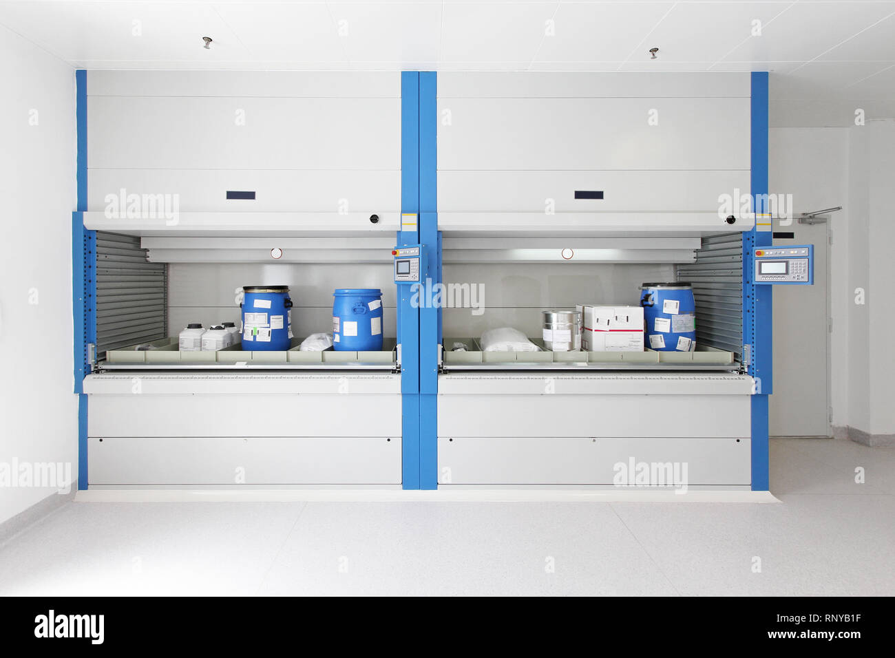 Vertical carousel storage shelves in warehouse Stock Photo - Alamy