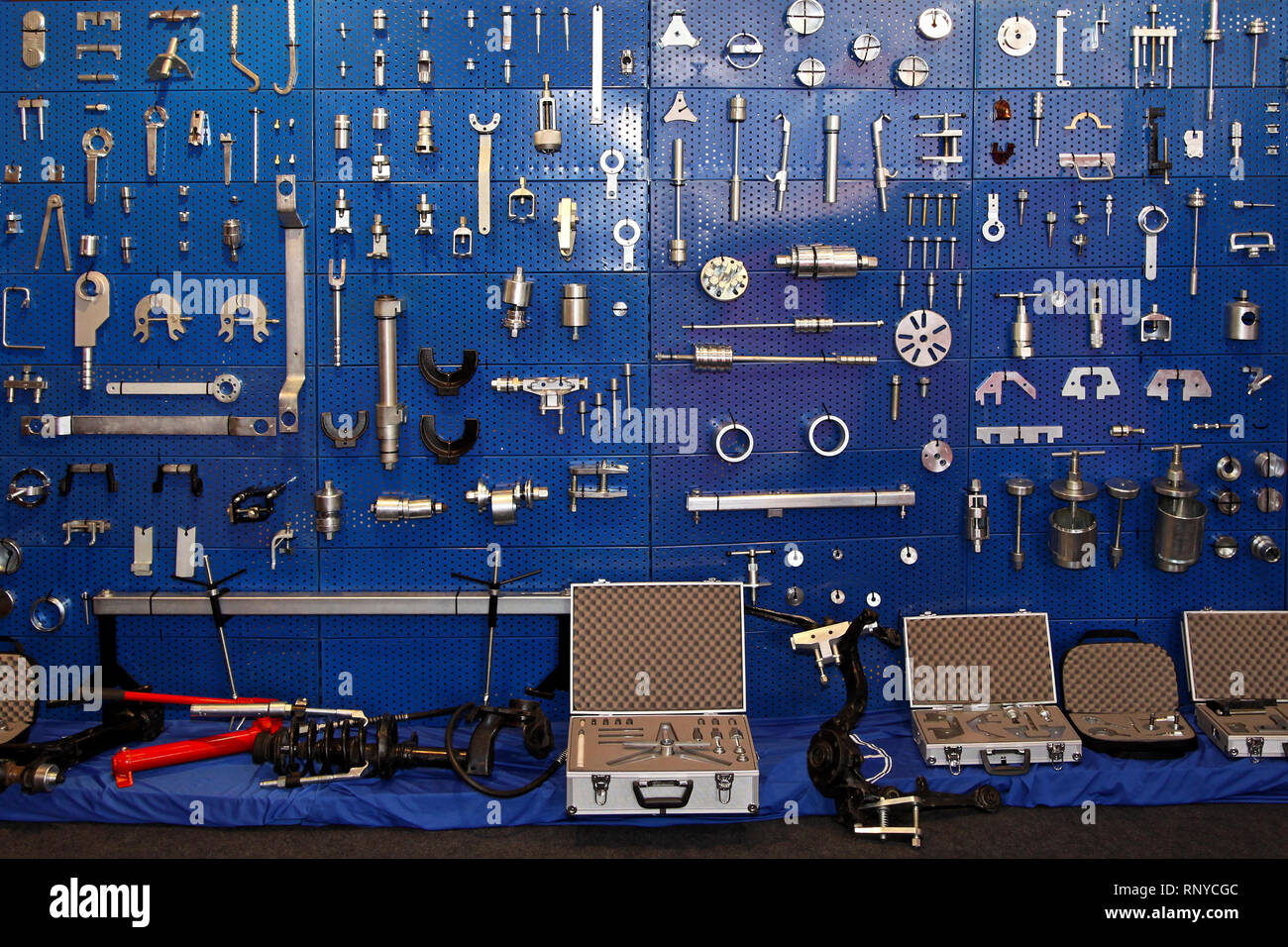 Tools in auto repair garage at wall Stock Photo - Alamy