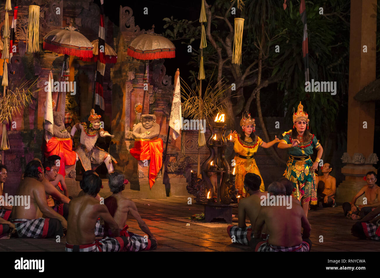 Hanoman monkey join the show with two female dancers dancing in front ...