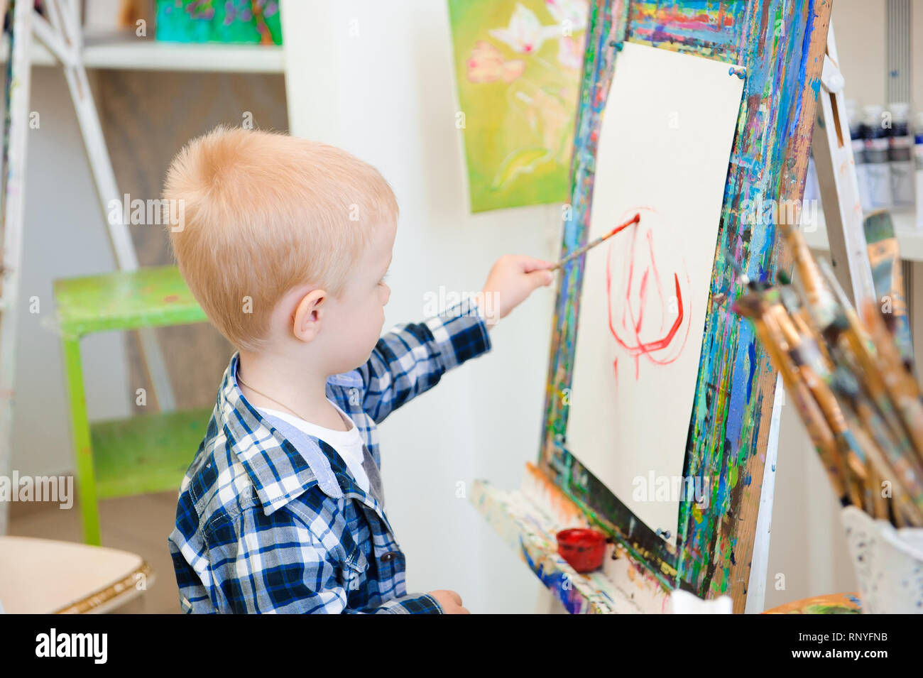a child draws a picture paints on art lesson Stock Photo - Alamy