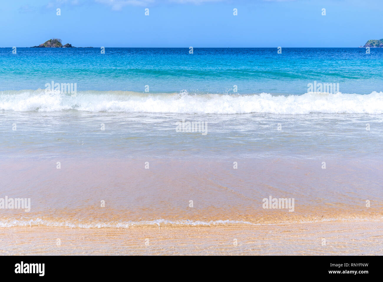Beautiful amazing gold colored sandy beach with soft waves isolated ...