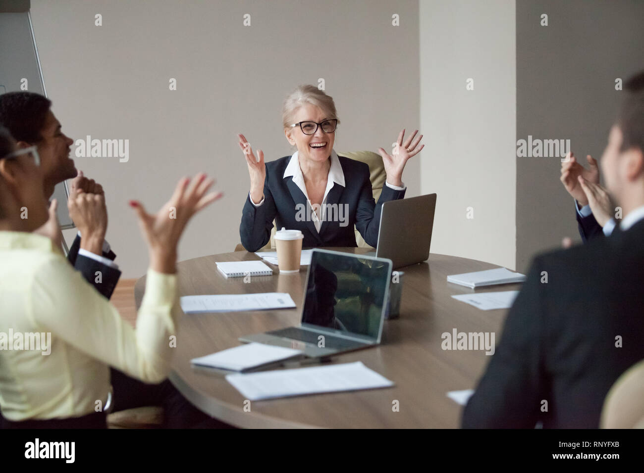 Cheerful excited business team hi-res stock photography and images - Alamy