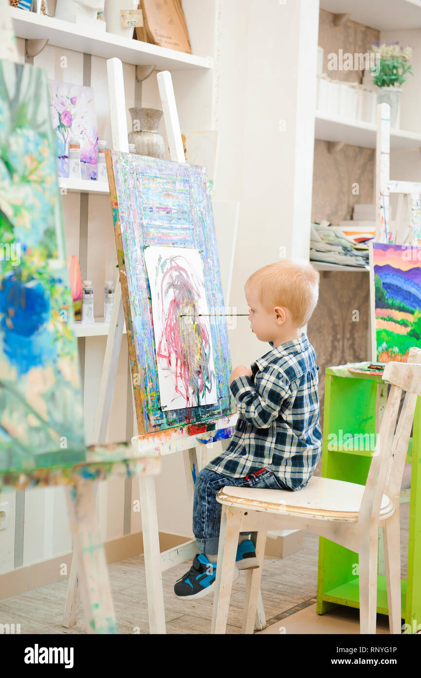 a child draws a picture paints on art lesson Stock Photo - Alamy