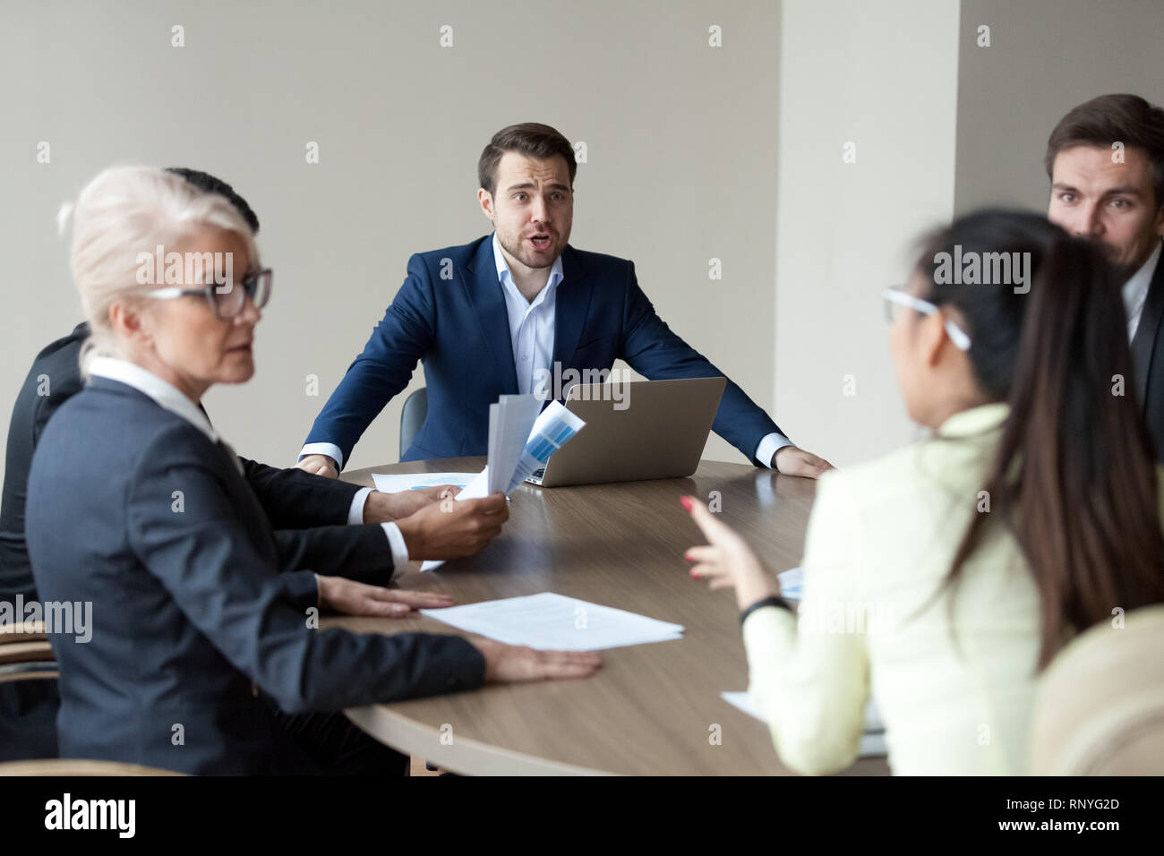 Angry executive shouting having disagreement with employee at group ...