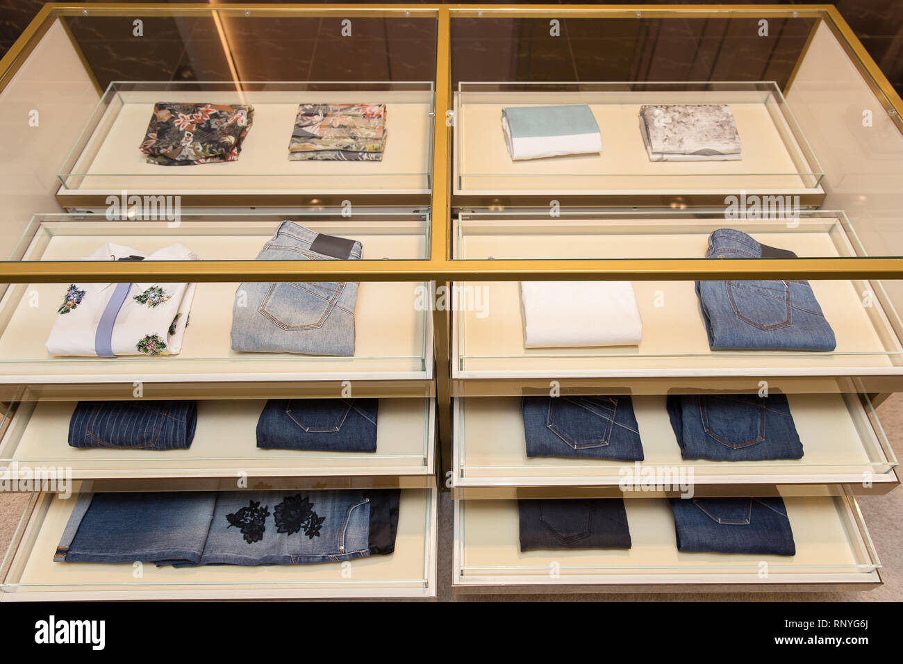 Stack of folded jeans on store shelves hi-res stock photography and ...