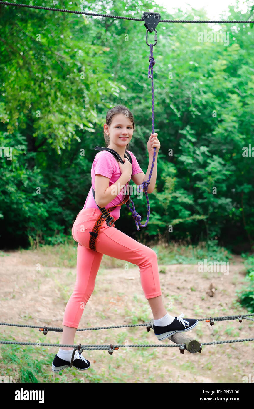 adventure climbing high wire park - hiking in the rope park girl Stock ...