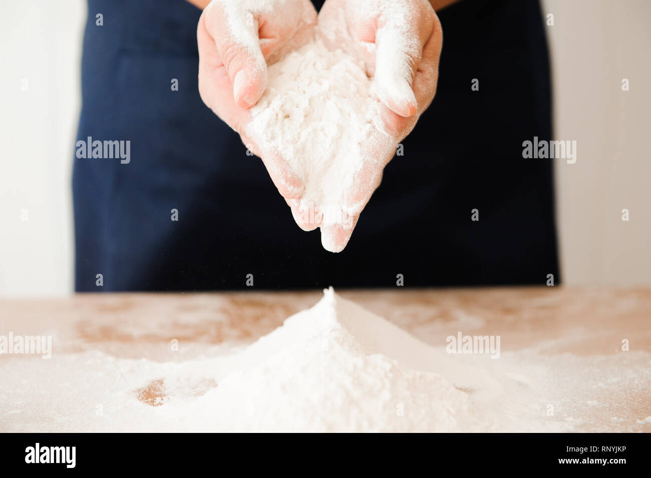 Making dough by female hands at bakery Stock Photo - Alamy