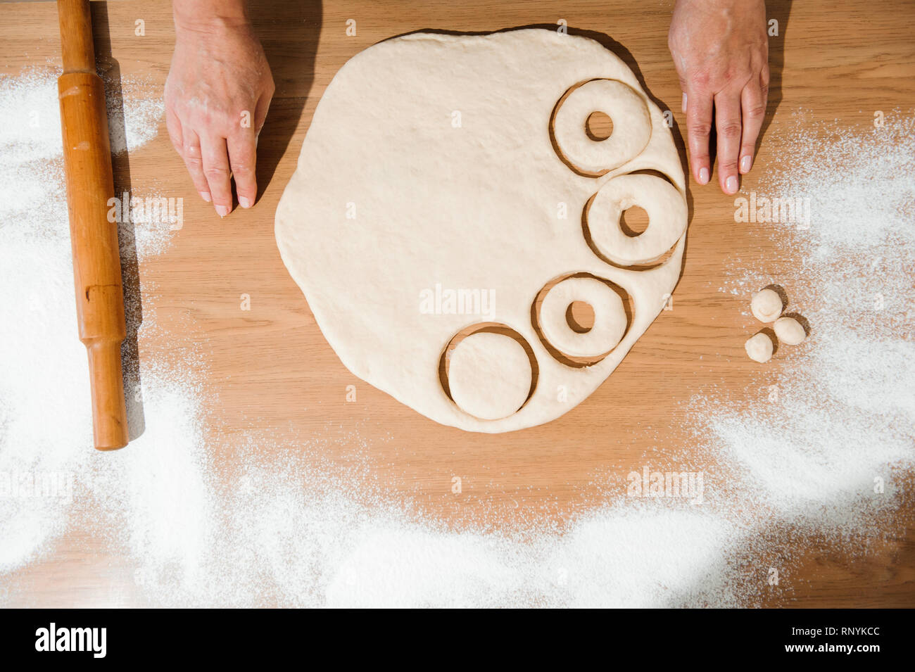 Chef preparing dough - cooking donuts process in the kitchen Stock ...