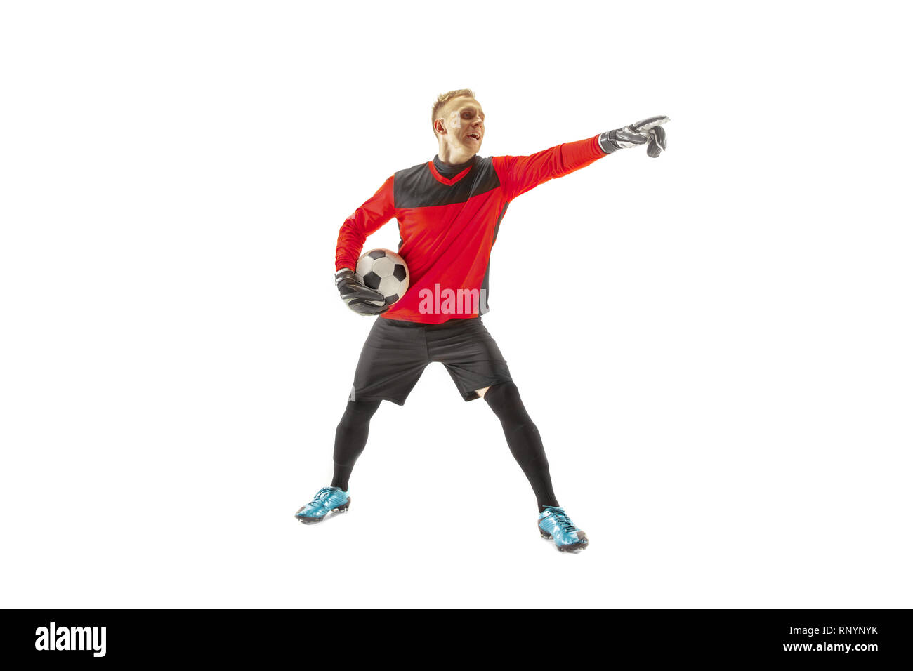 One male soccer player goalkeeper pointing away and screaming isolated ...