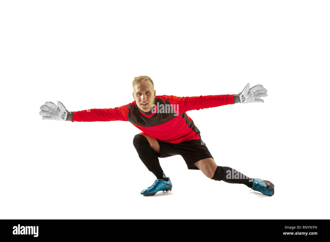 Goalkeeper ready to save on white studio background. Soccer football ...
