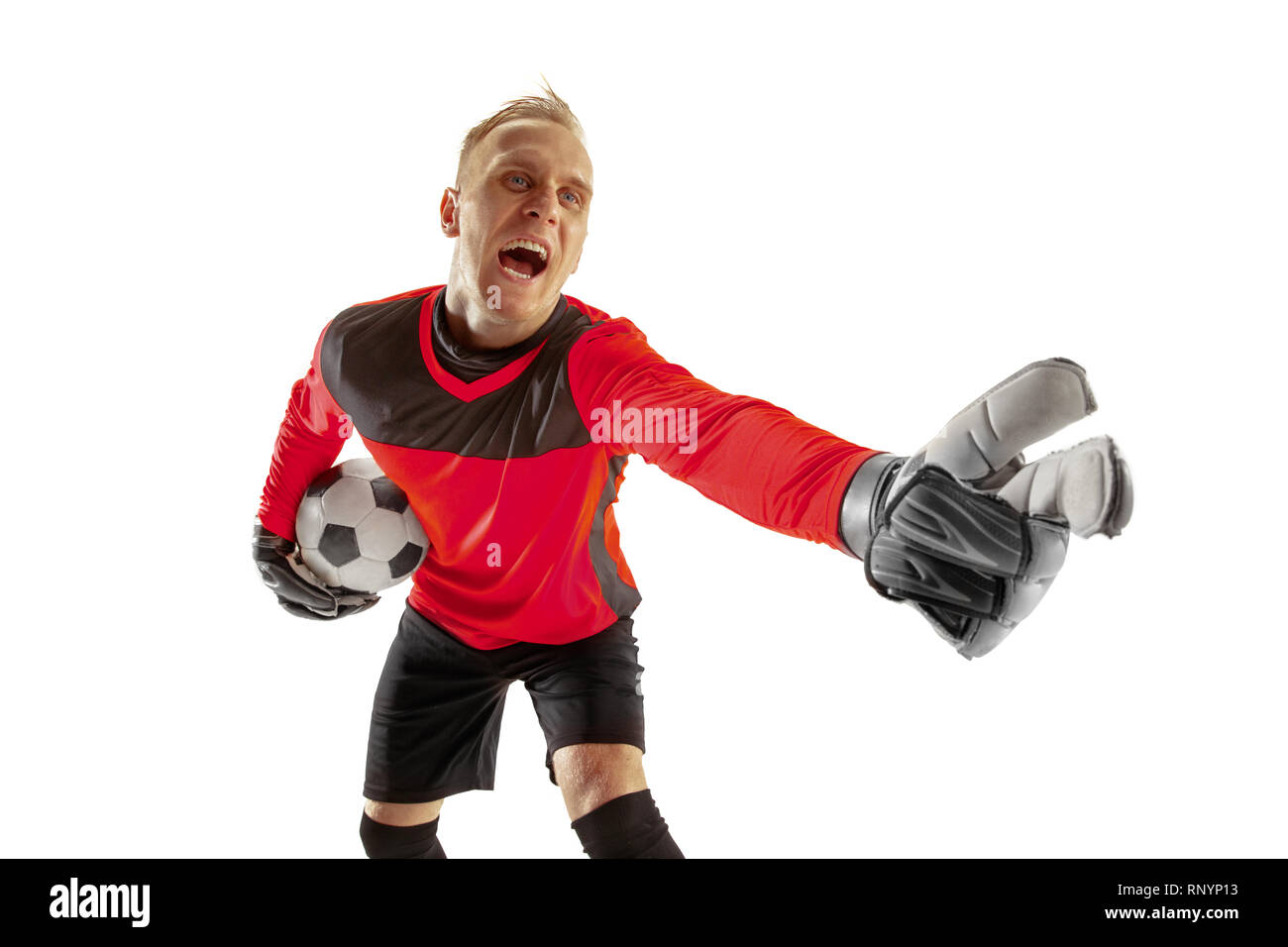 One male soccer player goalkeeper pointing away and screaming isolated ...