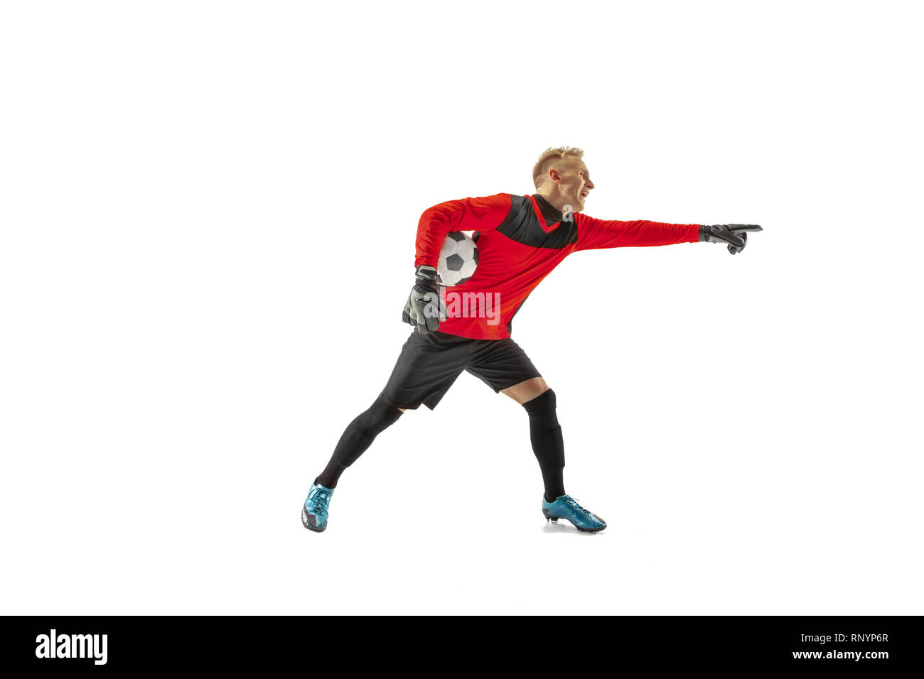 One male soccer player goalkeeper pointing away and screaming isolated ...