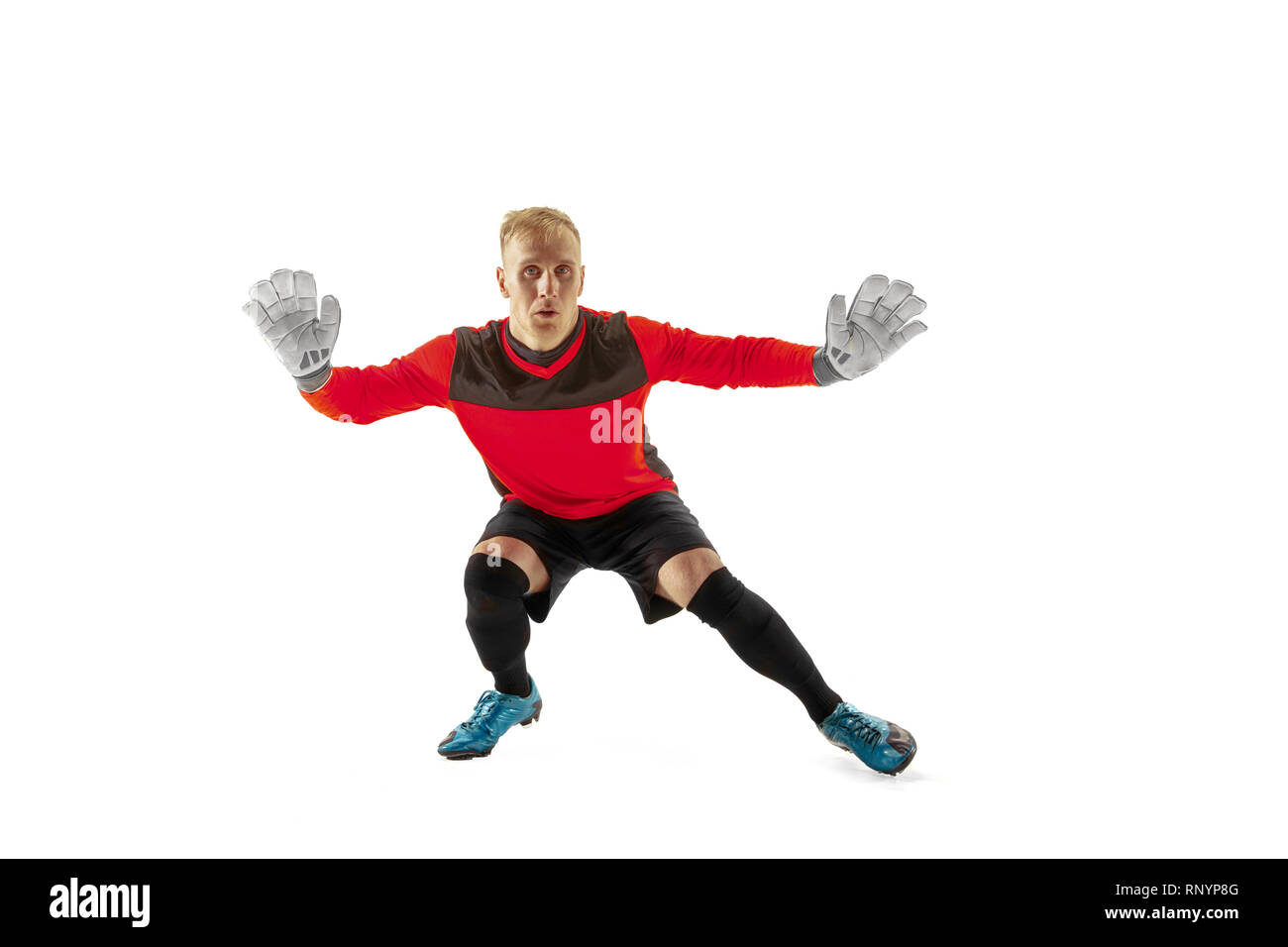 Goalkeeper ready to save on white studio background. Soccer football ...