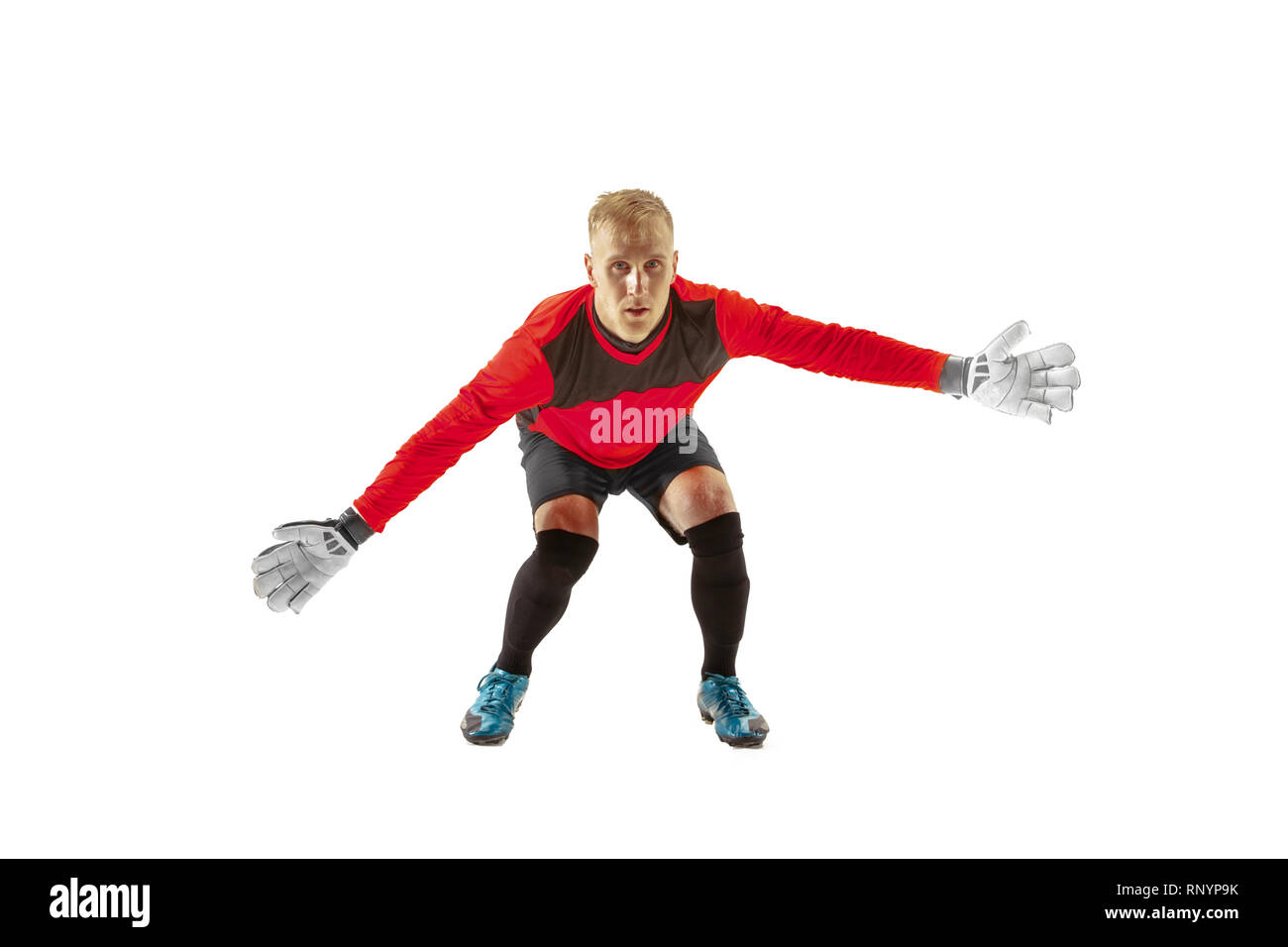 Goalkeeper ready to save on white studio background. Soccer football ...