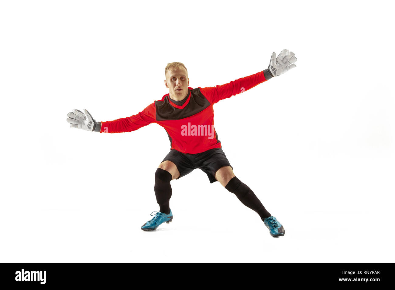 Goalkeeper ready to save on white studio background. Soccer football ...