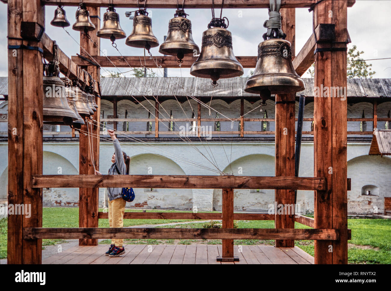 Girl ringing the bells of Andronikov monastery in Moscow Stock Photo ...