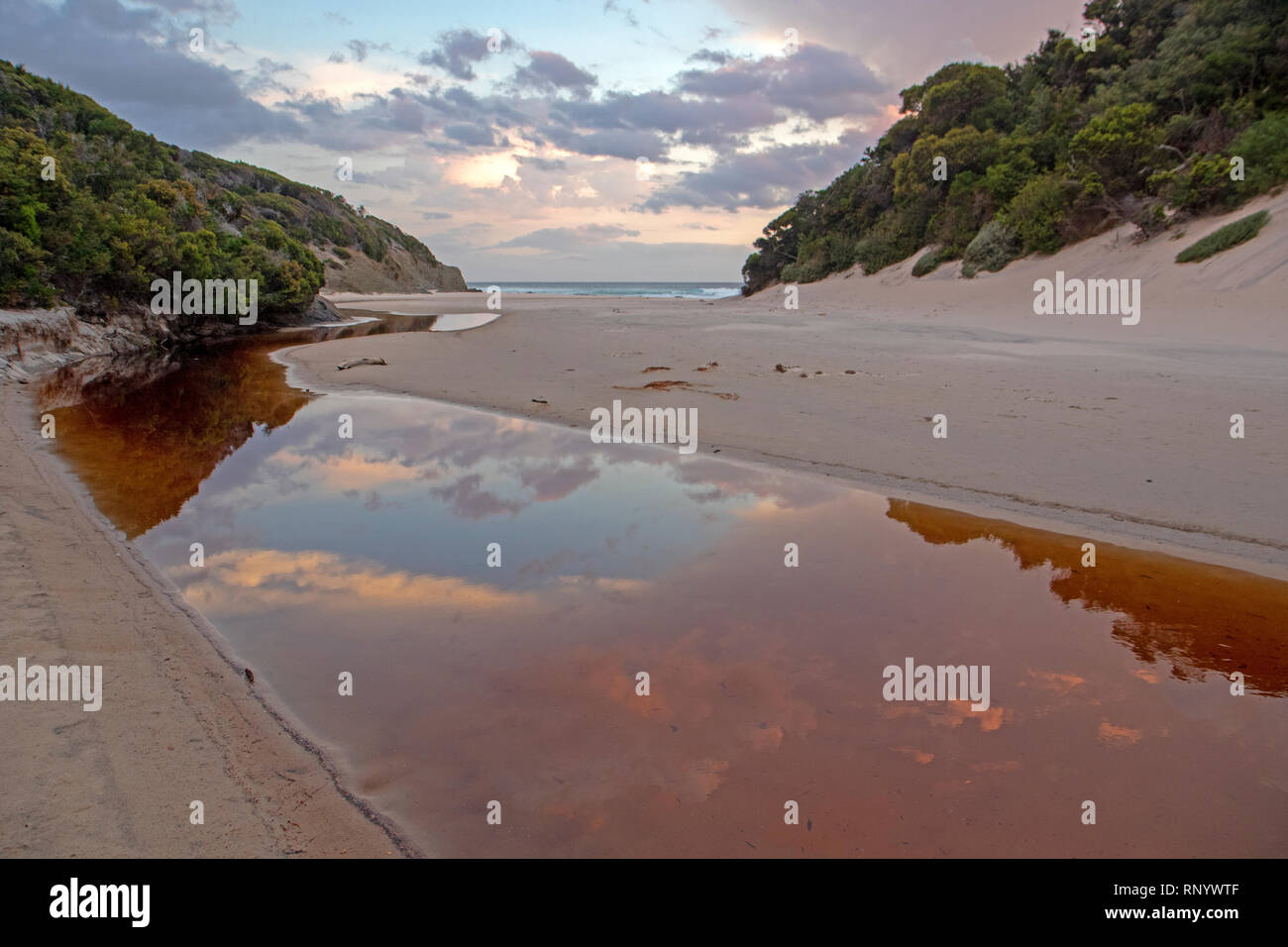 Sunset at Osmiridium Beach along the South Coast Track Stock Photo - Alamy