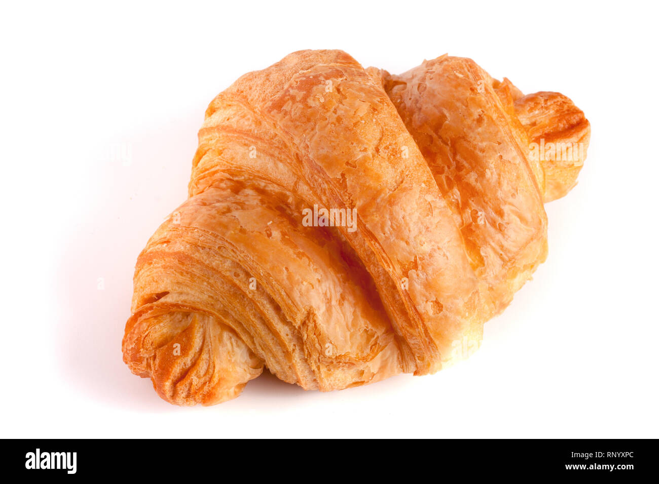 one croissant isolated on white background closeup Stock Photo - Alamy