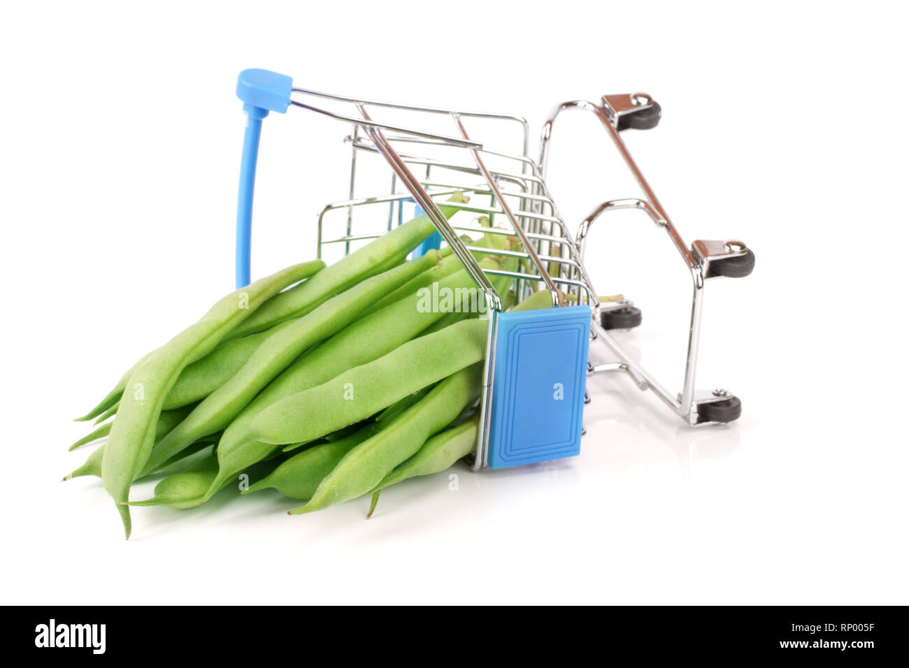 Green beans in mini shopping cart isolated on a white background Stock ...
