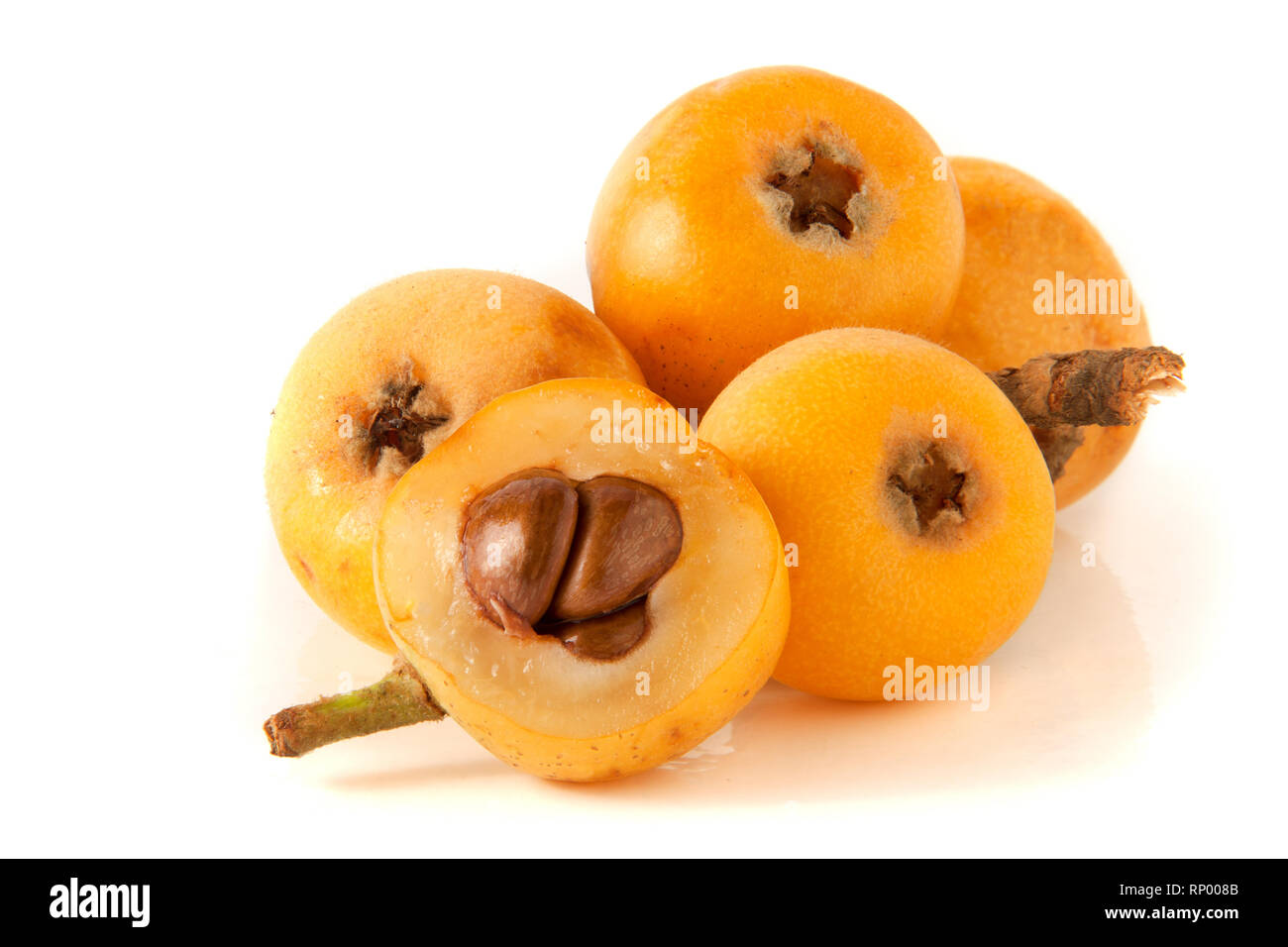 Ripe loquat or Eriobotrya japonica with leaf isolated on white ...