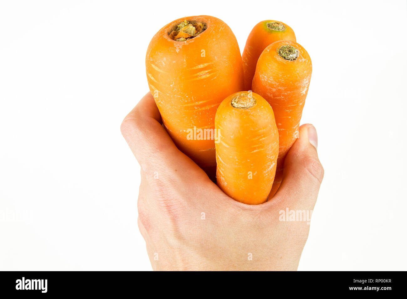human hand holding a fresh carrot. Healthy food, diet Stock Photo - Alamy