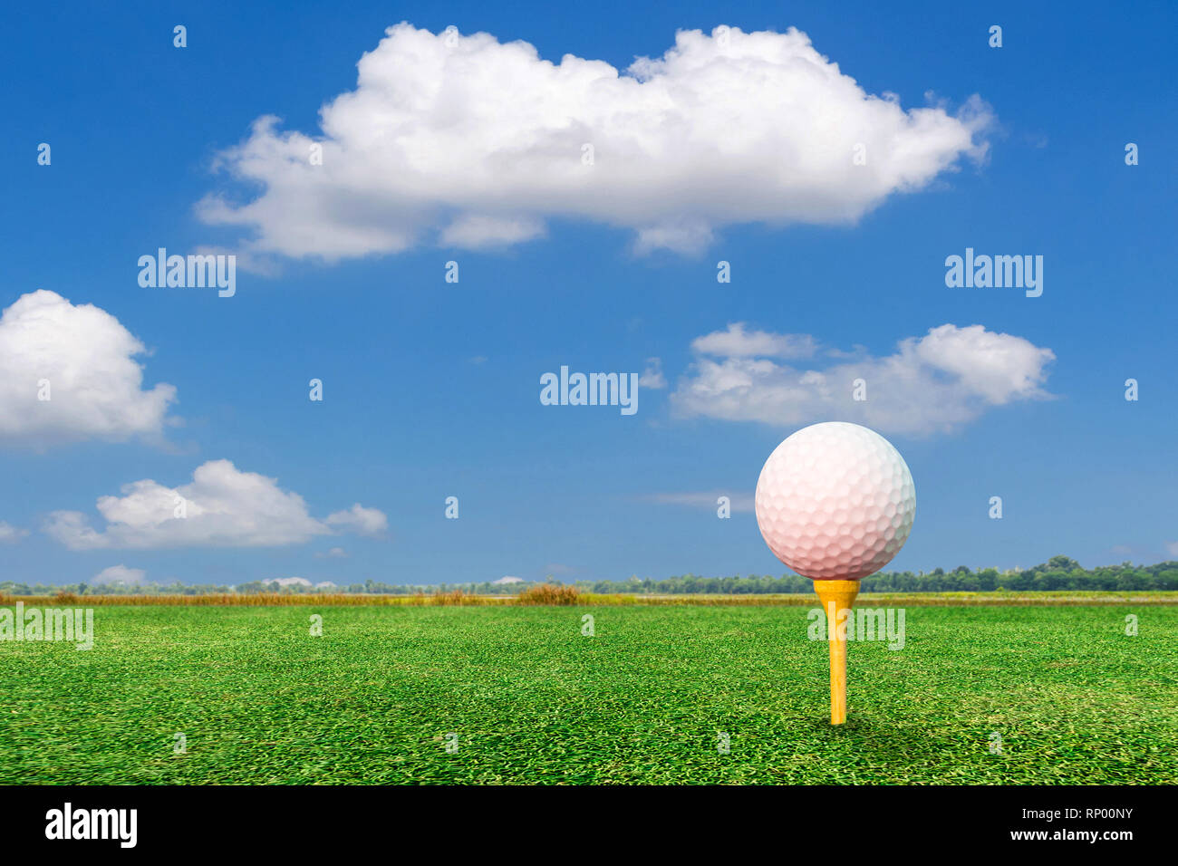 Golf ball on tee and nature background Stock Photo - Alamy