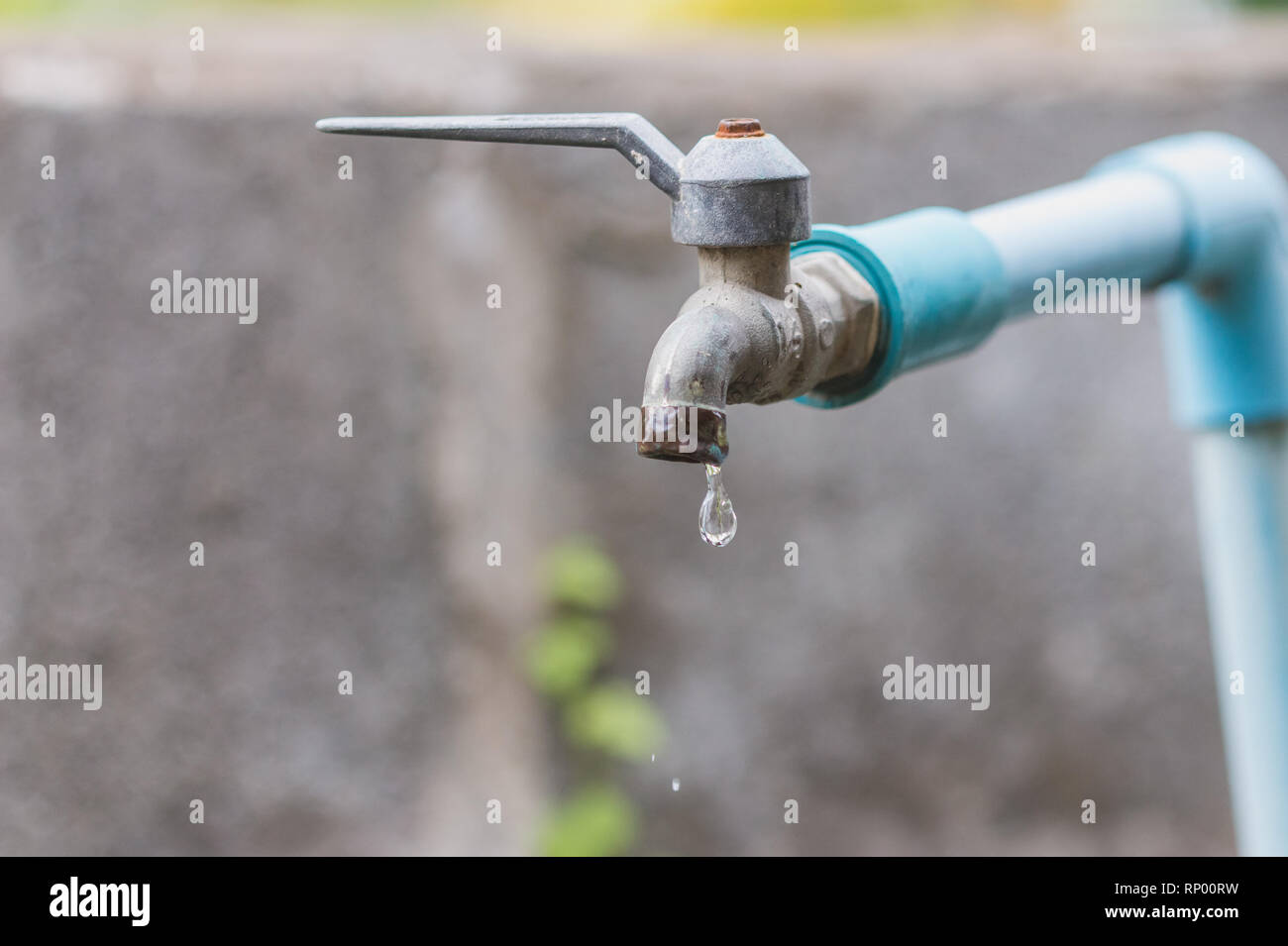 Faucet with a water drop / Water consumption concept Stock Photo - Alamy